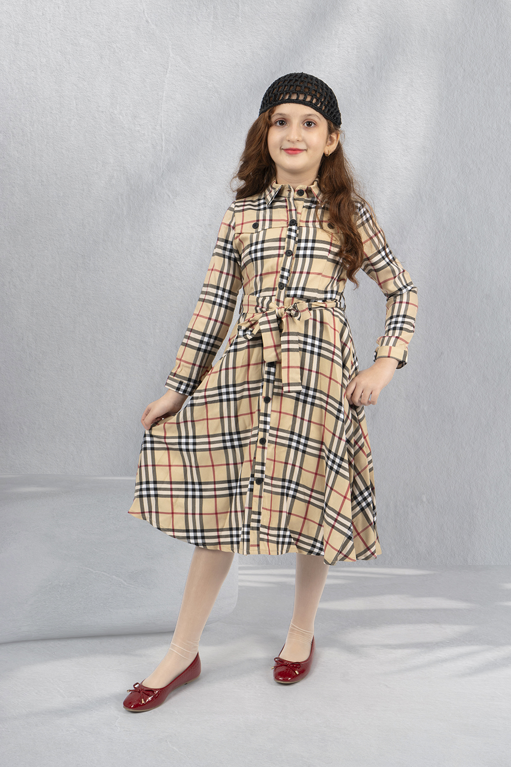 Girls' checkered dress with a collar, front buttons, and a tie at the ...