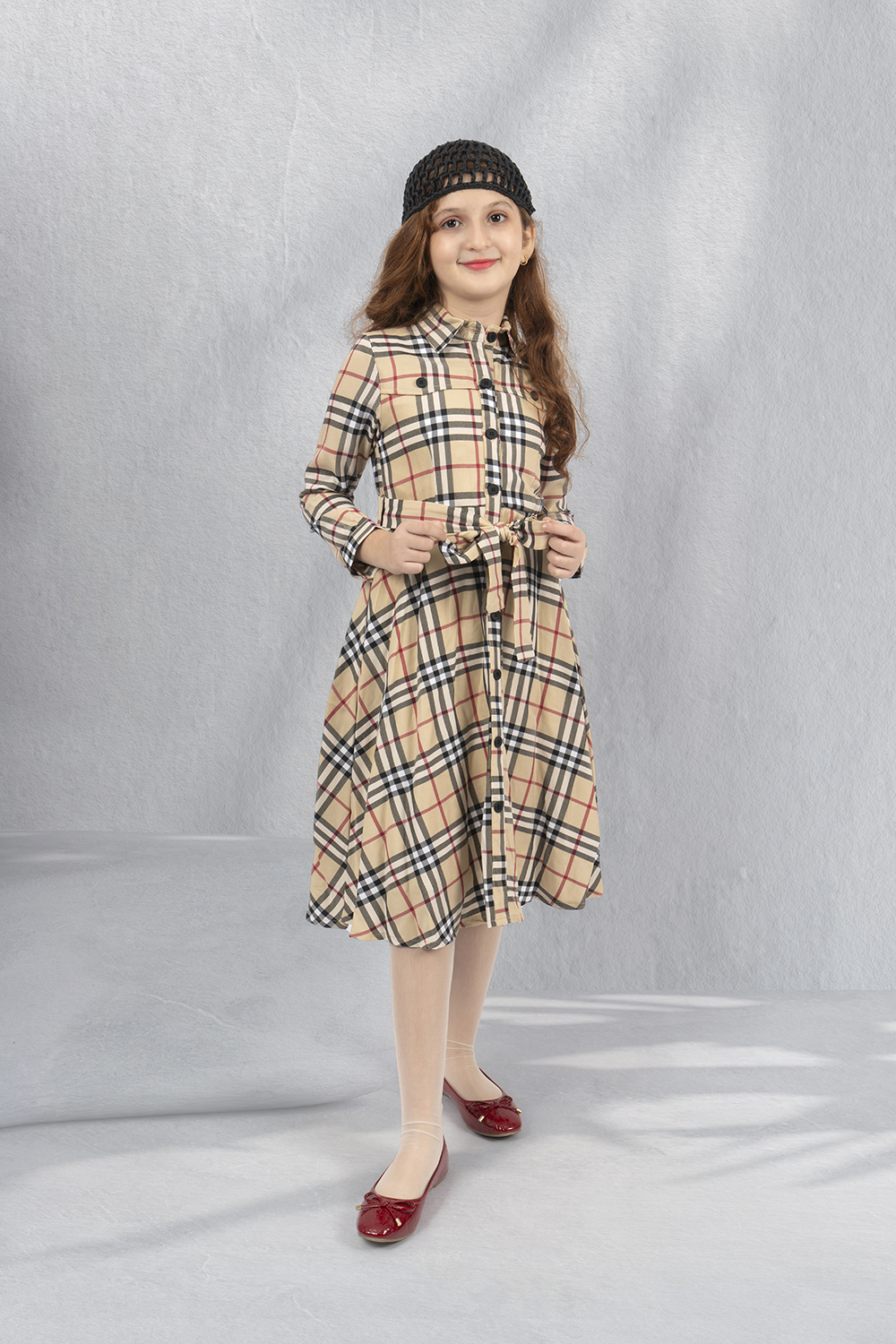 Girls' checkered dress with a collar, front buttons, and a tie at the ...