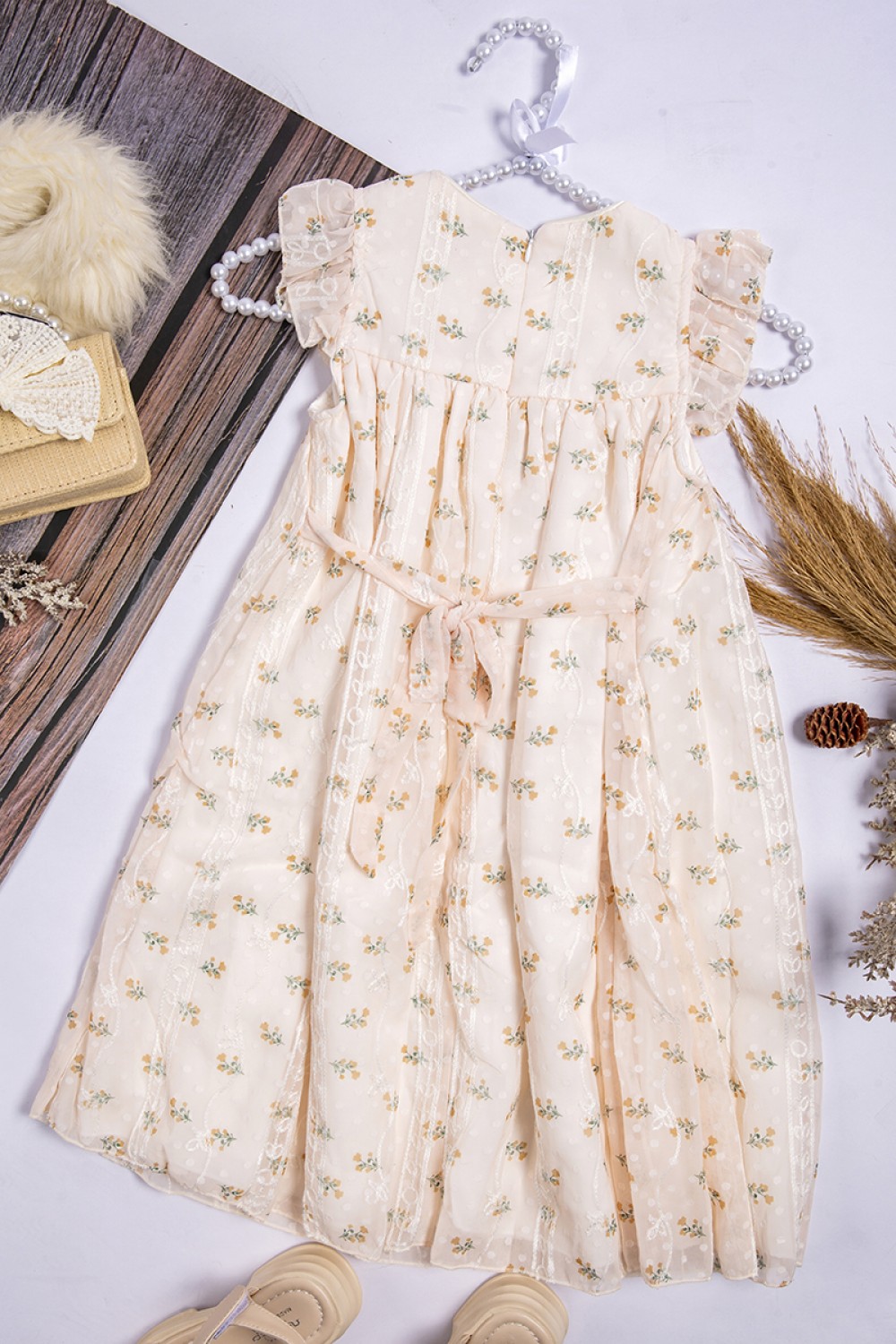 Elegant beige girl's dress with short sleeves and a round chest opening ...