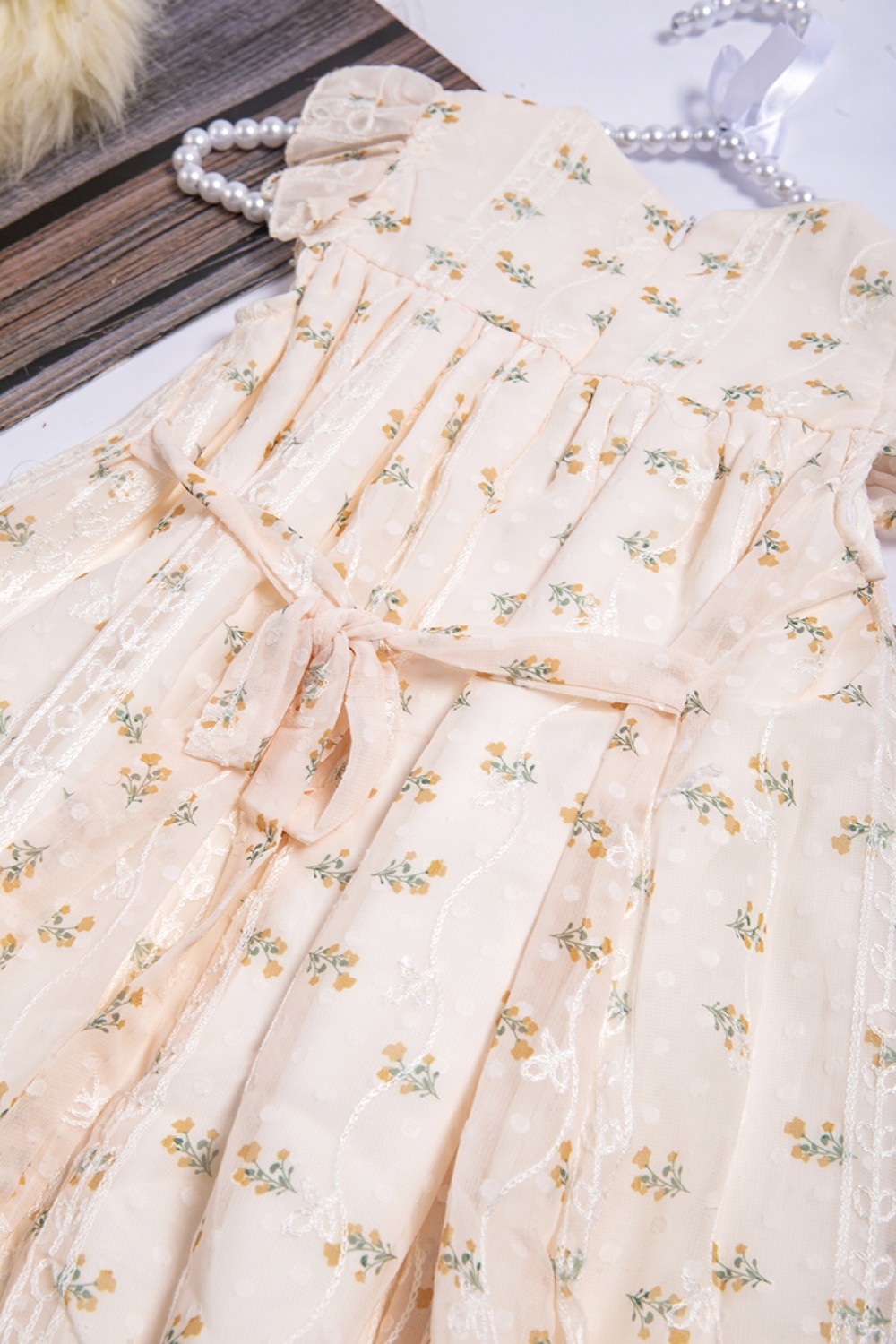 Elegant beige girl's dress with short sleeves and a round chest opening ...