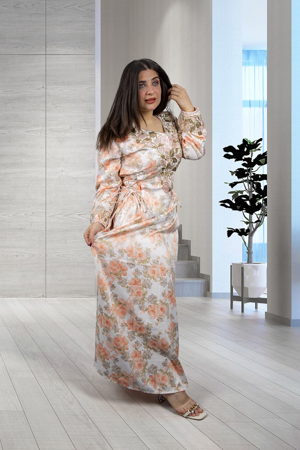An elegant Emirati women's mokhwar made of floral fabric with a ...