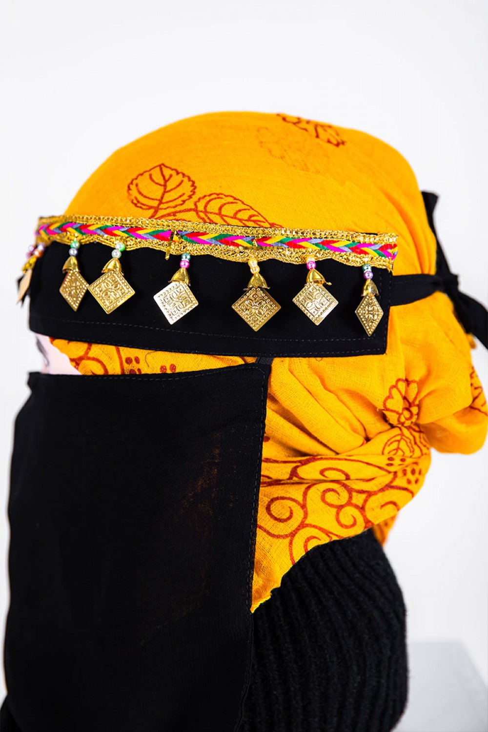 A black women's burqa for Foundation Day, decorated at the top with ...