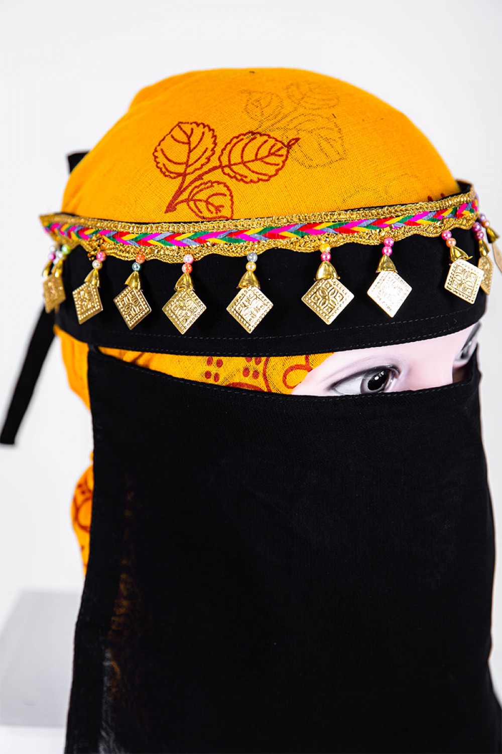 A black women's burqa for Foundation Day, decorated at the top with ...