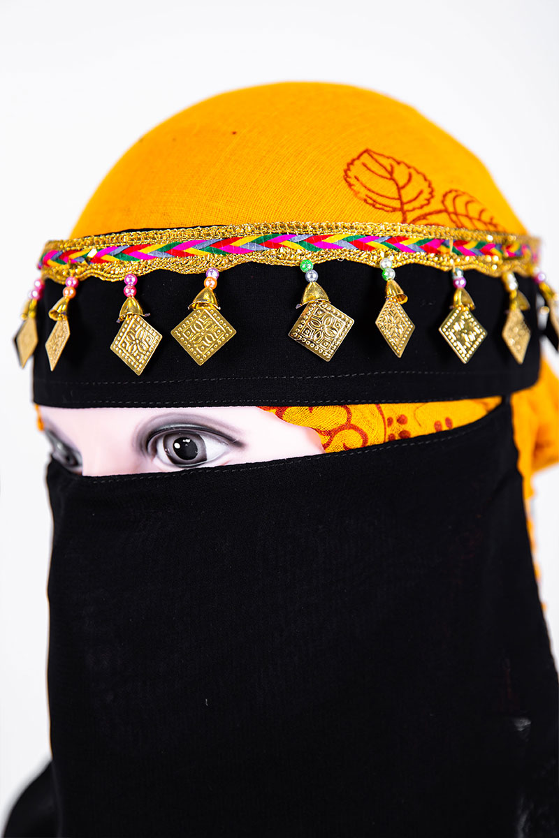 A black women's burqa for Foundation Day, decorated at the top with ...