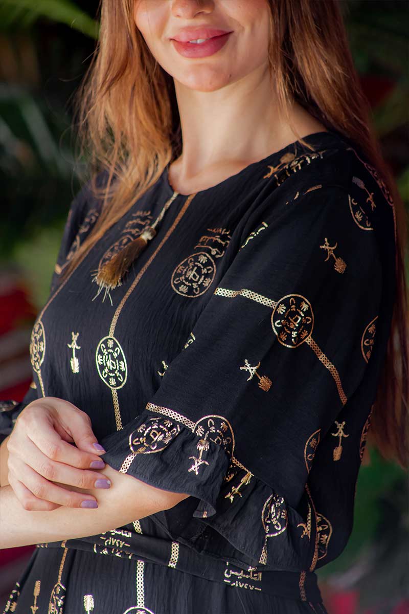 Women's black dress with short sleeves decorated with a print of the ...